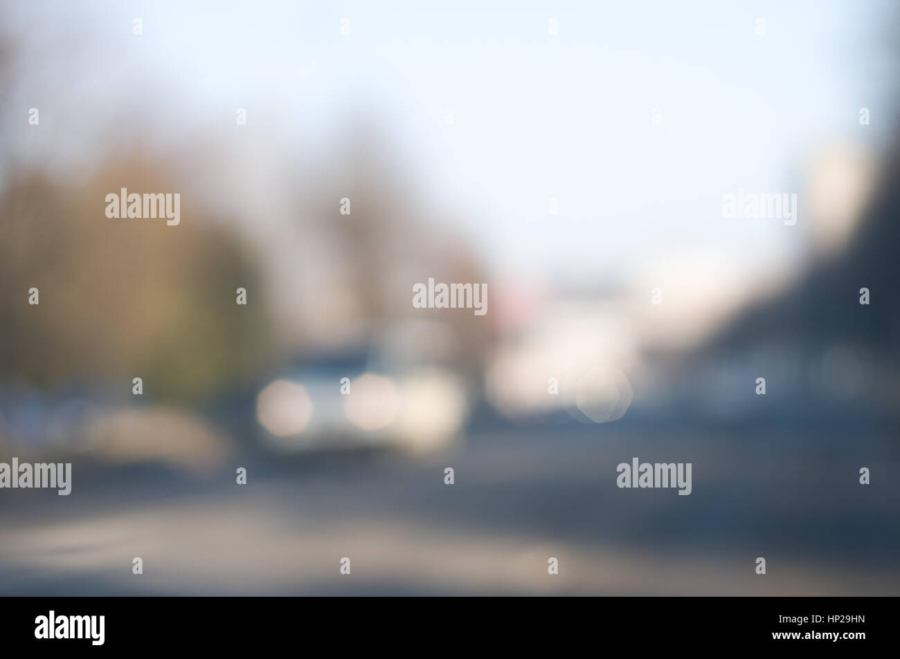 Traffic abstract background with blurry buildings, street signs and ...