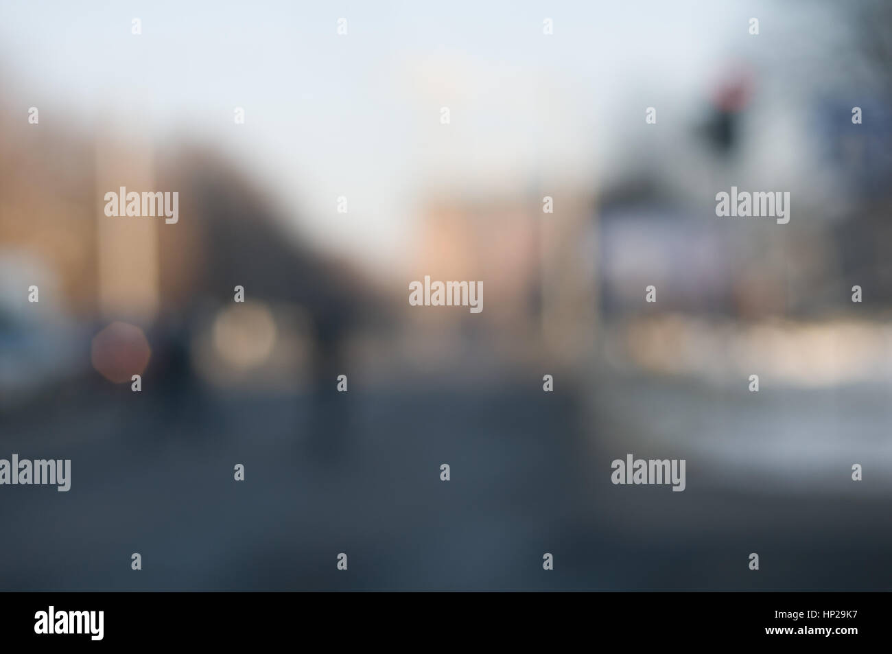 Traffic abstract background with blurry buildings, street signs and ...