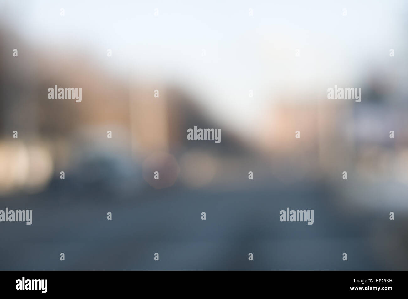 Traffic abstract background with blurry buildings, street signs and ...