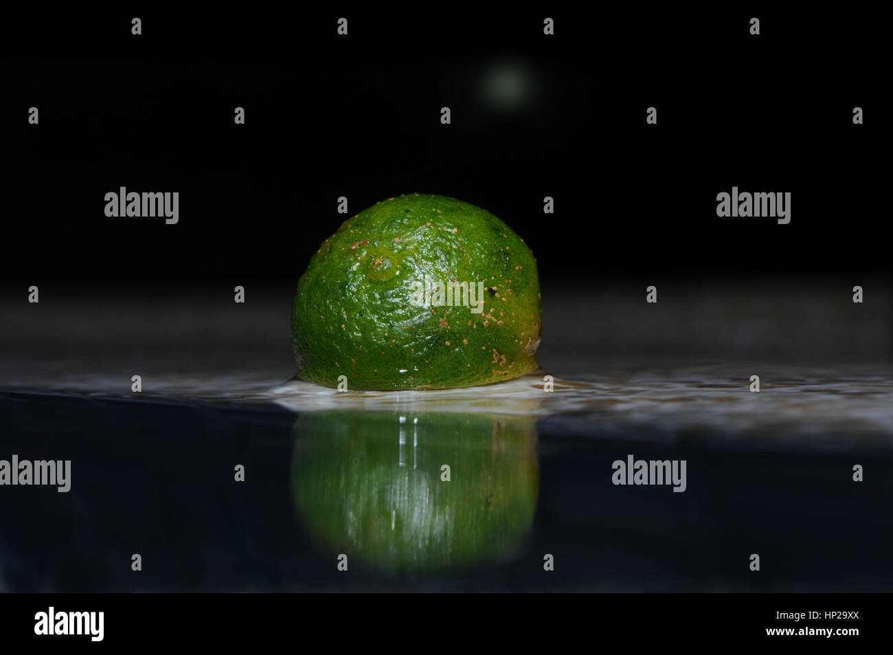 Reflection of a tiny lemonsito (kalamansi) in water, Panglao ...
