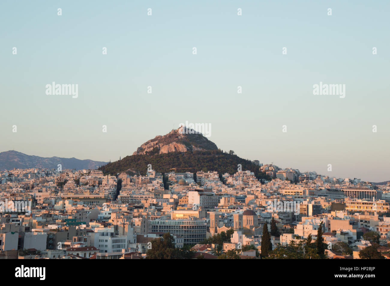 The sun setting in Athens Stock Photo - Alamy
