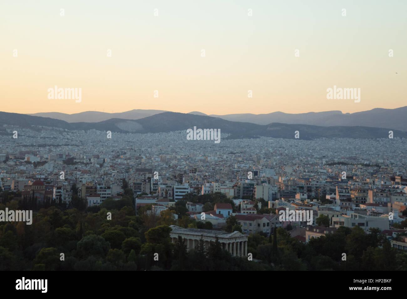 The sun setting in Athens Stock Photo - Alamy