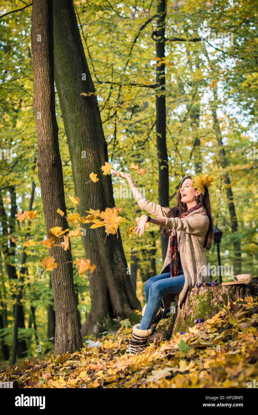 girl throws up leaves Stock Photo - Alamy