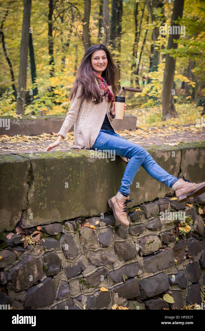 girl sitting on the stone Stock Photo - Alamy