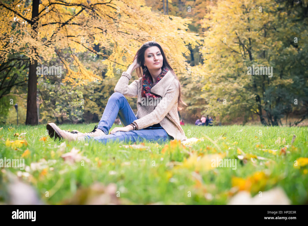 girl sitting on the grass Stock Photo - Alamy
