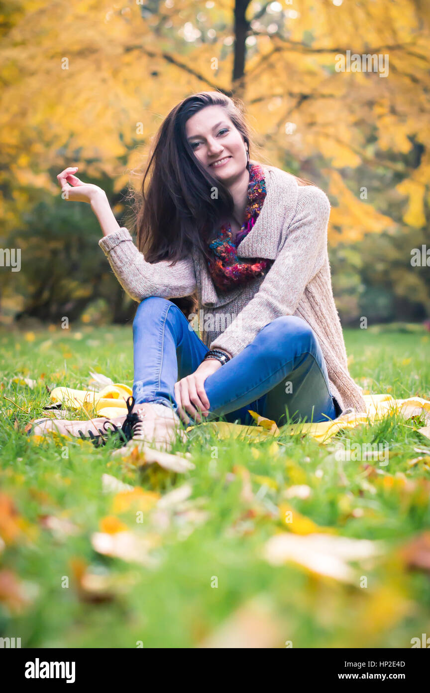 girl sitting on the grass Stock Photo - Alamy