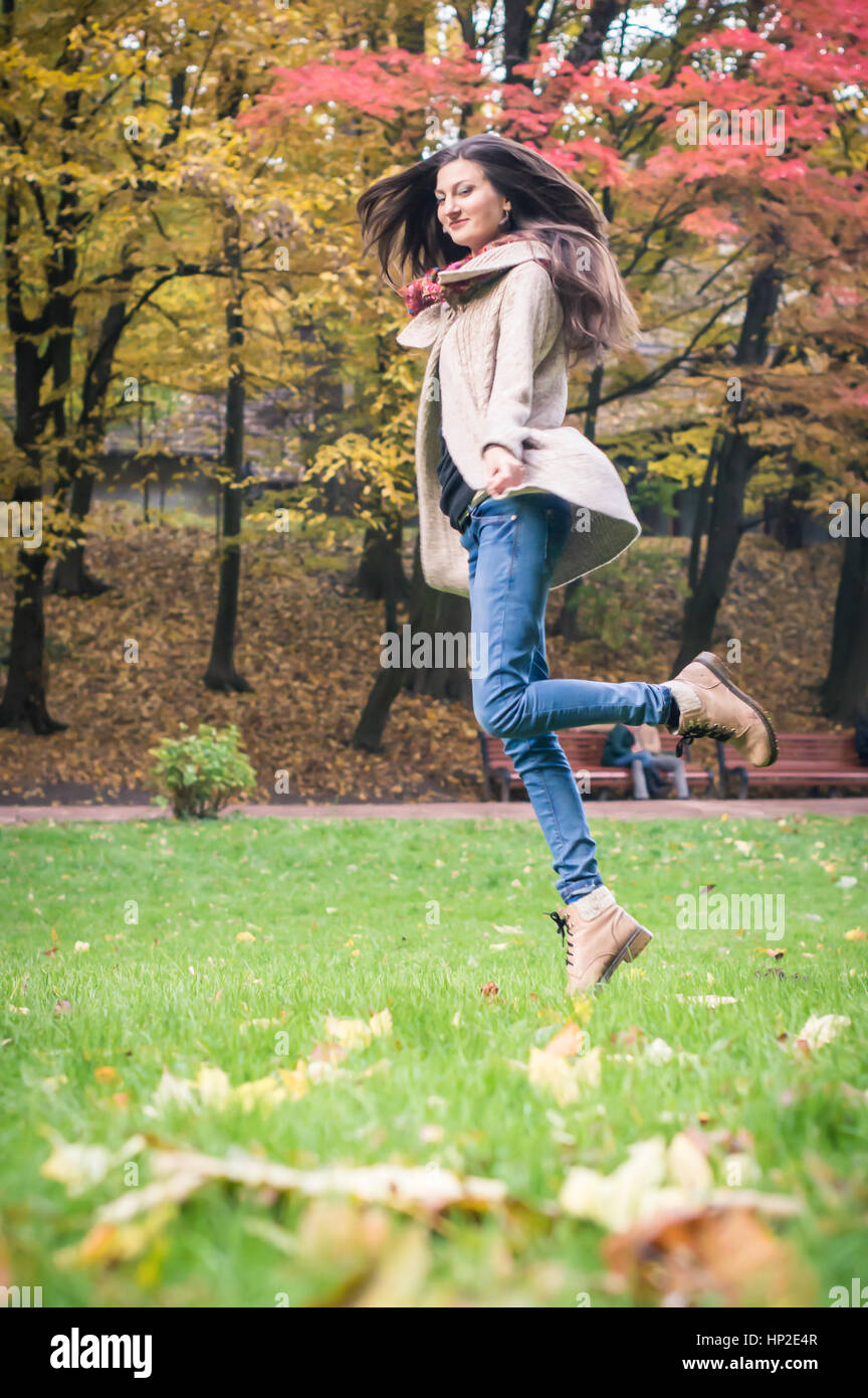 happy girl jumping on grass Stock Photo - Alamy