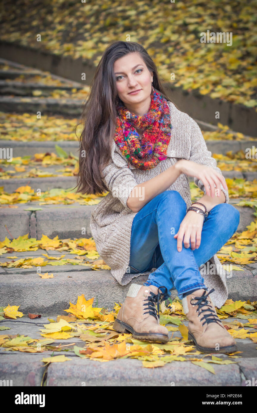 girl sitting on stone steps Stock Photo - Alamy