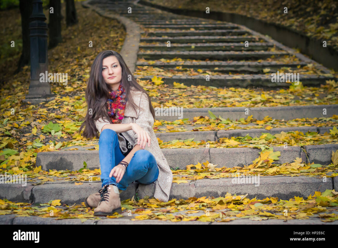 girl sitting on stone steps Stock Photo - Alamy