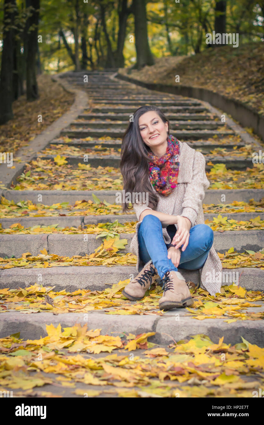girl sitting on stone steps Stock Photo - Alamy