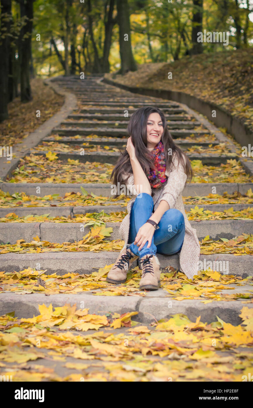 girl sitting on stone steps Stock Photo - Alamy