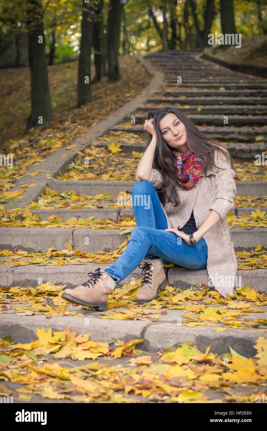 girl sitting on stone steps Stock Photo - Alamy