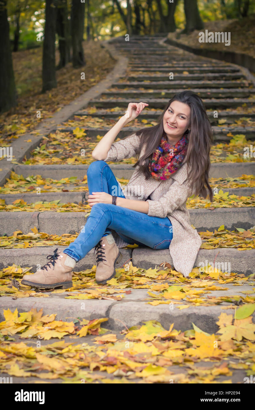 girl sitting on stone steps Stock Photo - Alamy