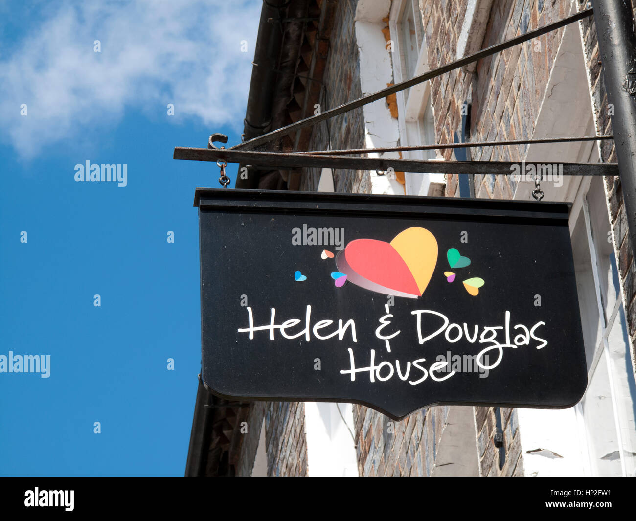 Helen & Douglas House sign over charity shop Stock Photo - Alamy