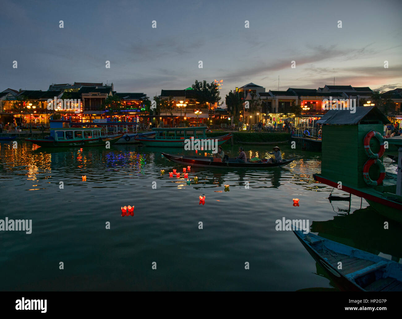 Candle lanterns float on the Thu Bon River for the full moon festival ...