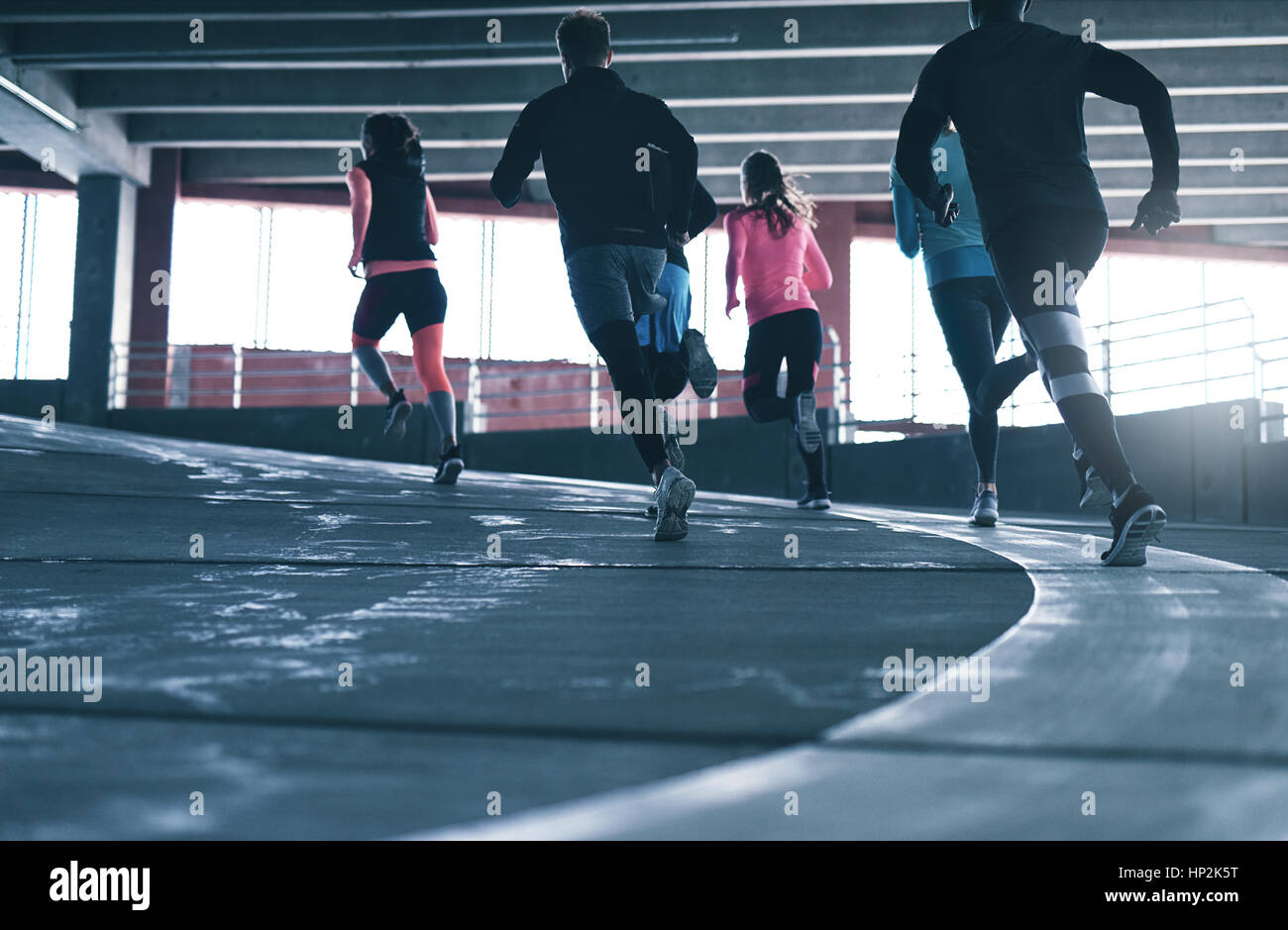 Back view of several people running over urban background. Copyspace ...