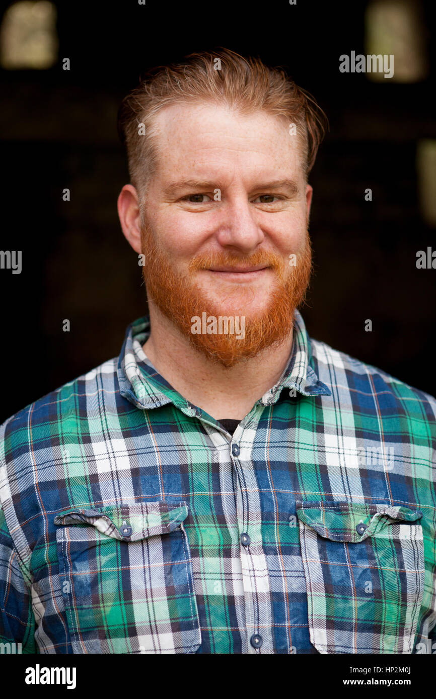 Portrait of red haired man with plaid shirt and long beard Stock Photo ...