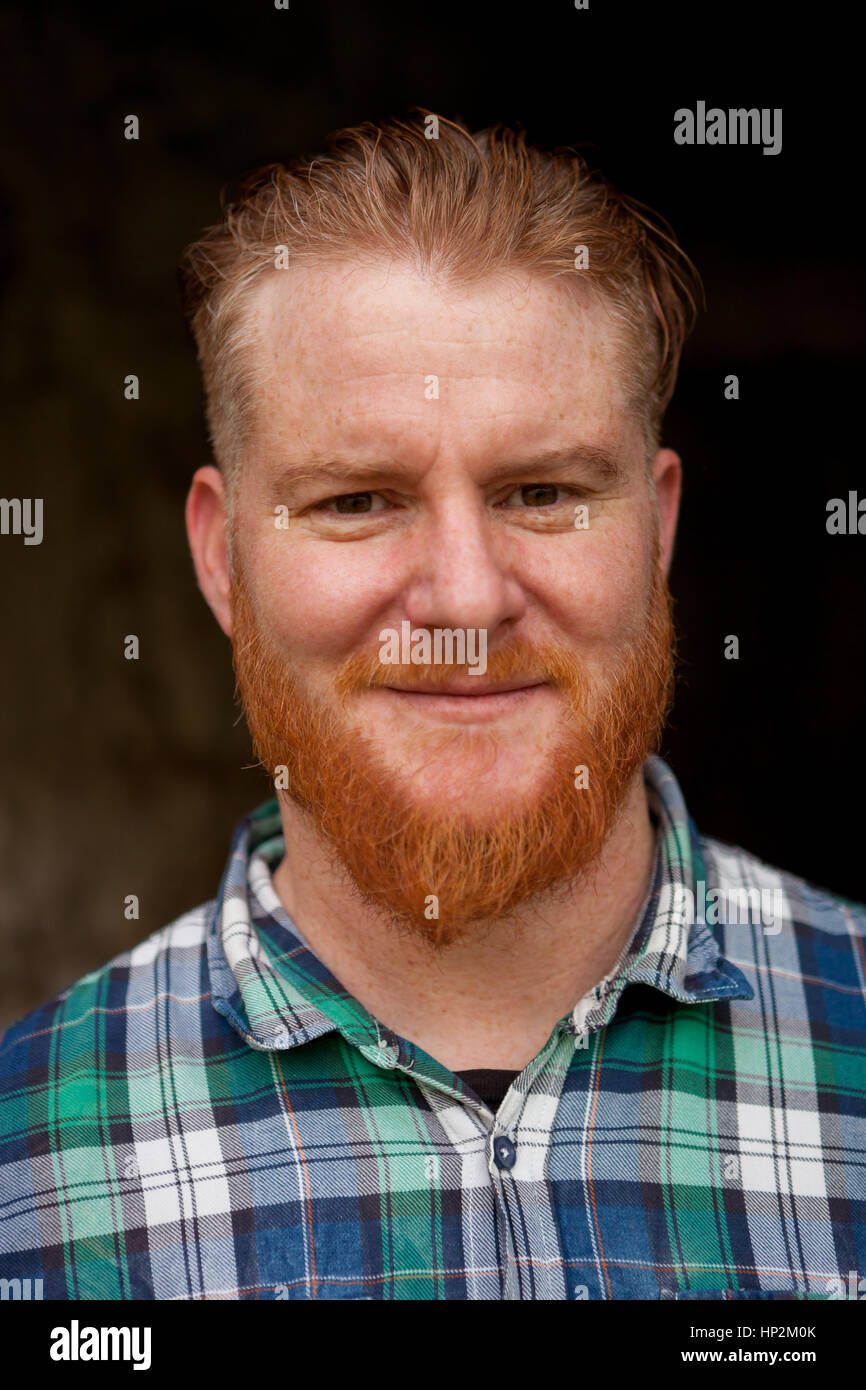 Portrait of red haired man with plaid shirt and long beard Stock Photo ...