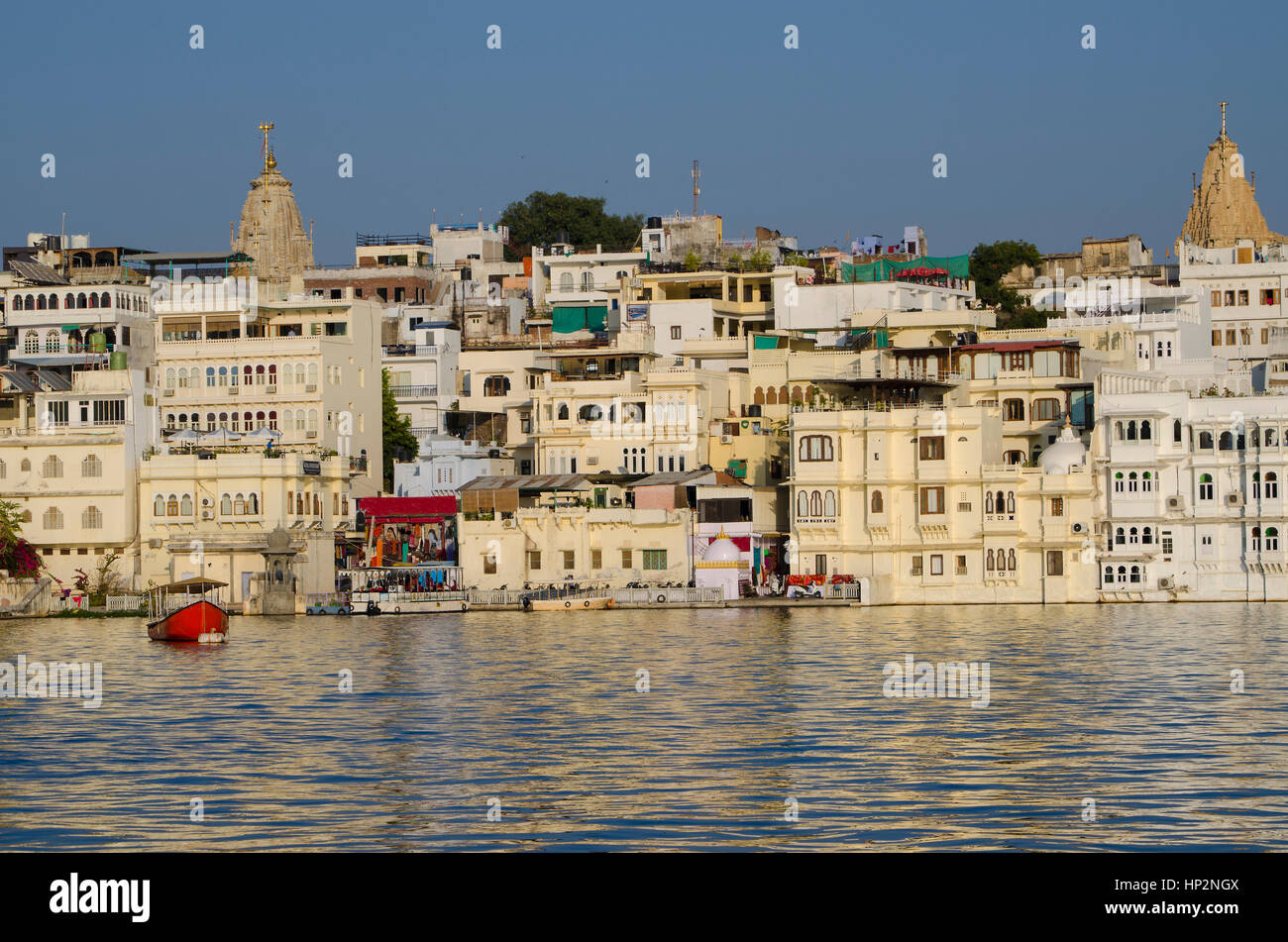 Beautiful landscape of the city on water at sunset in India Udaipur ...