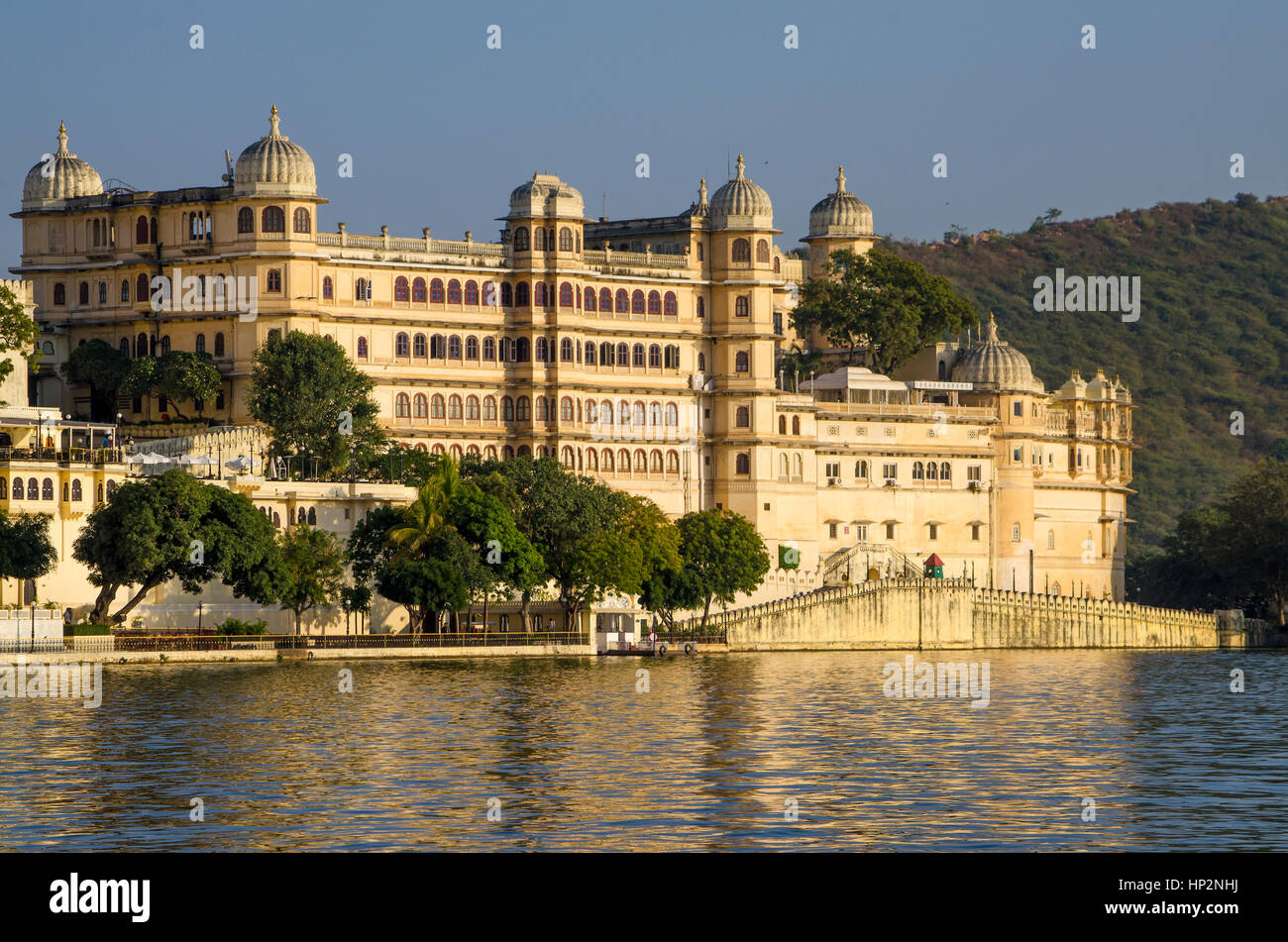 Beautiful landscape of the city on water at sunset in India Udaipur ...