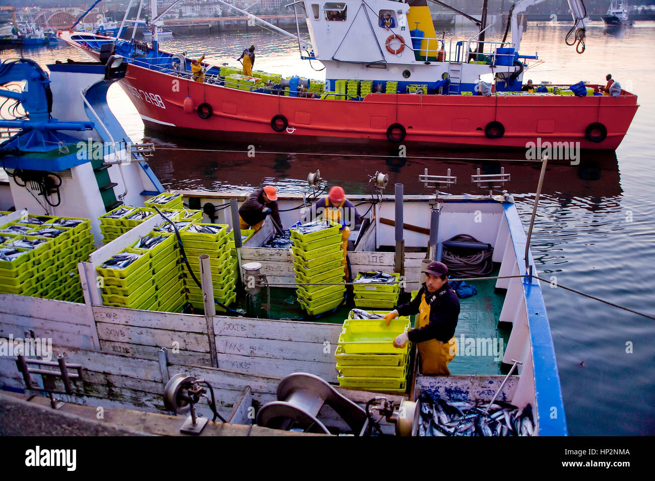 Fishermen in harbour Stock Photo - Alamy