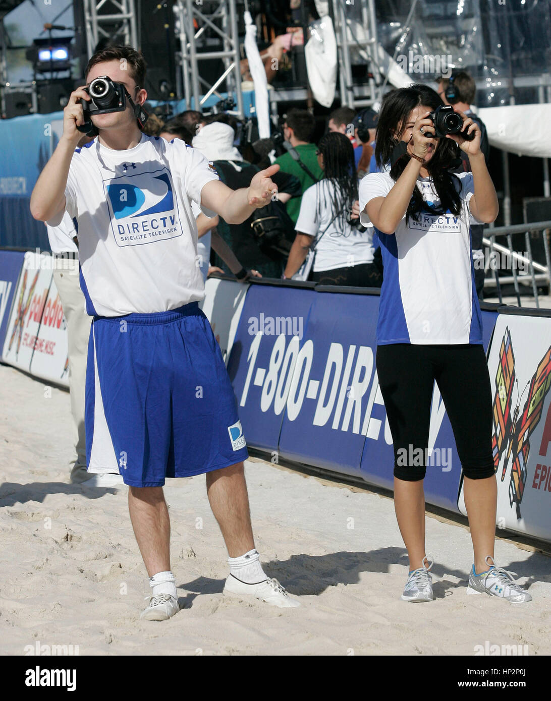 Ed Westwick and Jessica Szohr taking photos at the Directv Celebrity ...