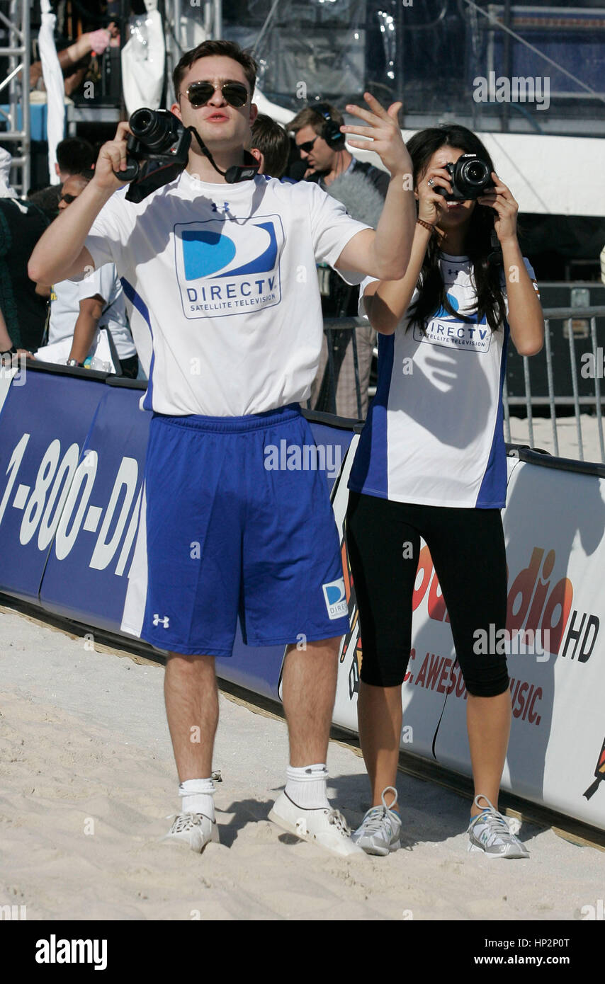 Ed Westwick and Jessica Szohr taking photos at the Directv Celebrity ...