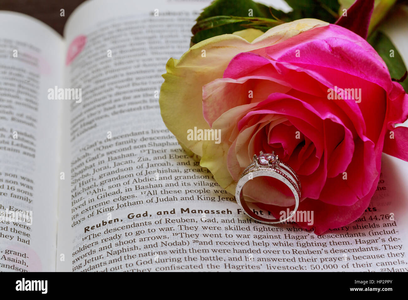 Wedding rings on Bible Stock Photo - Alamy