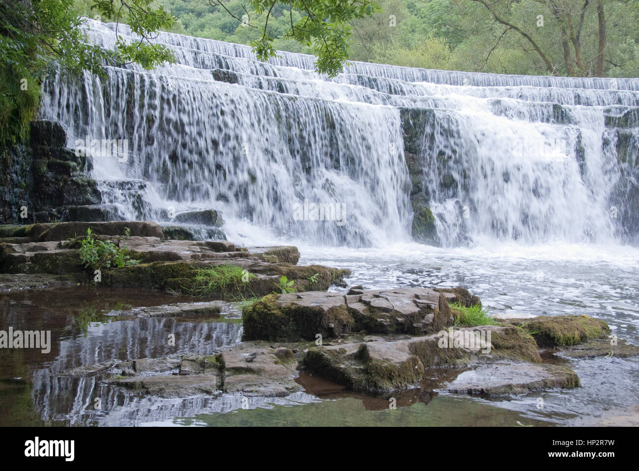 Derbyshire, UK - July 20 2014 - Man made waterfall Monsal Dale weir on ...