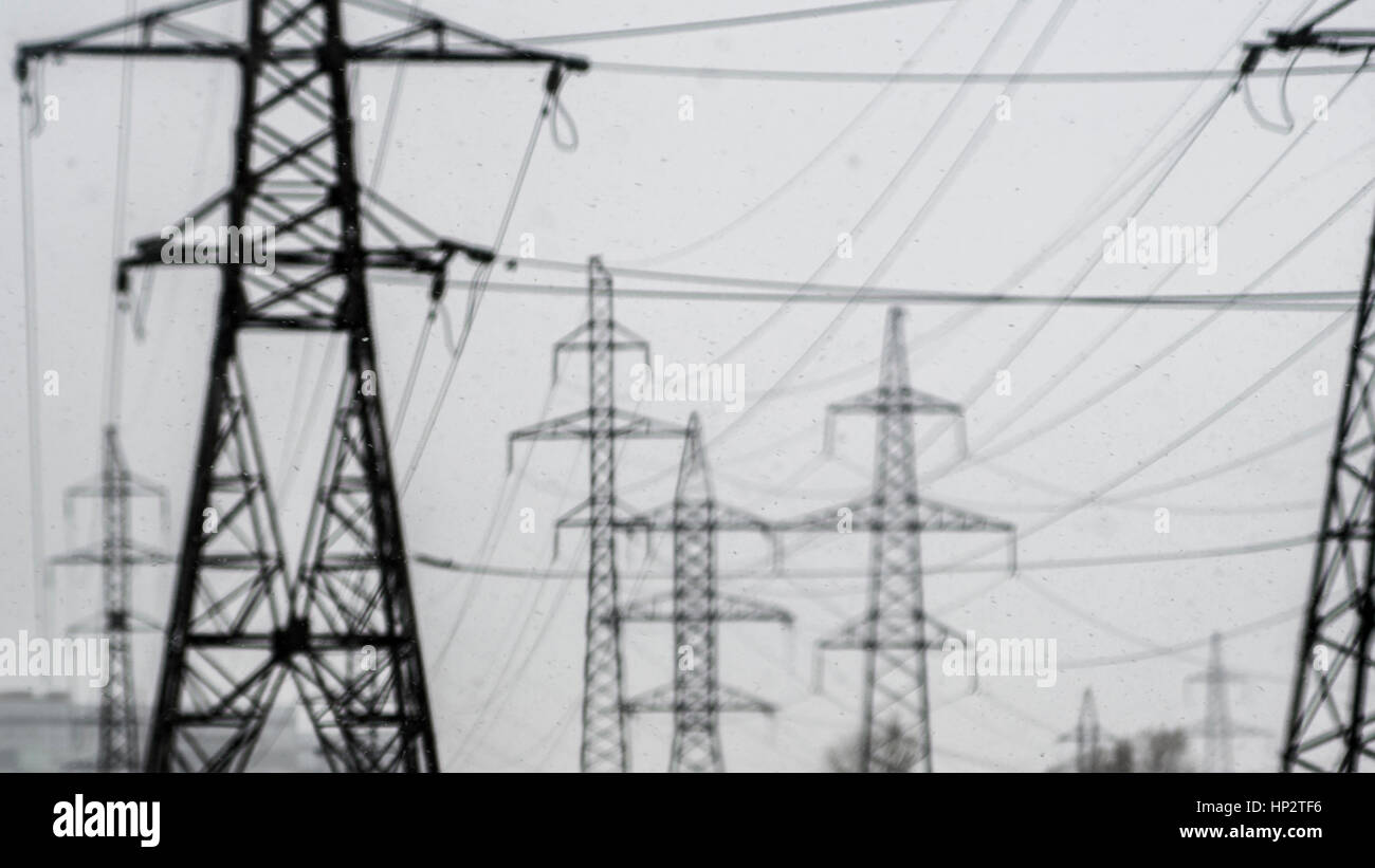power lines on a blurred background, pollution in the air, gray sad ...