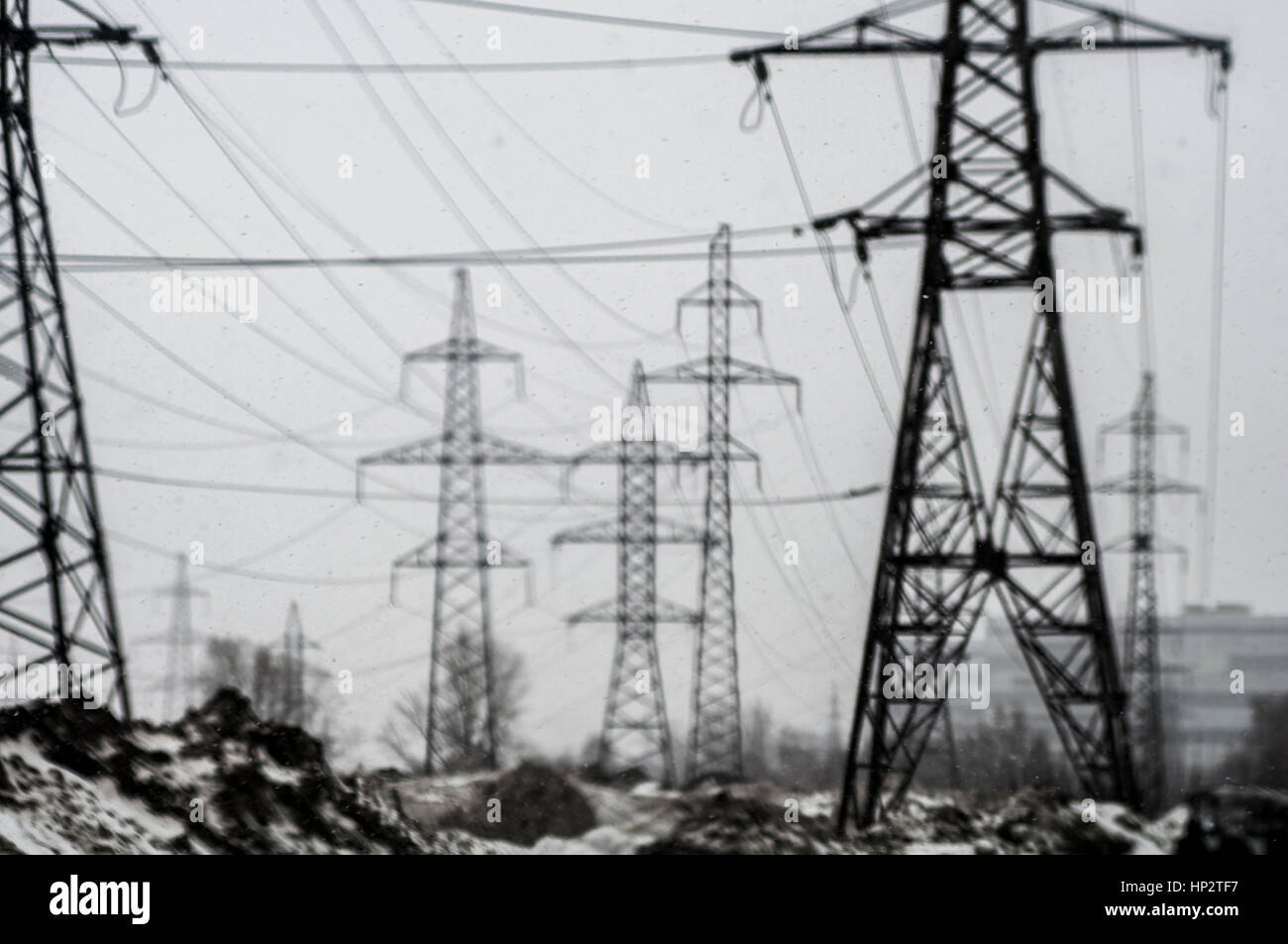 power lines on a blurred background, pollution in the air, gray sad ...