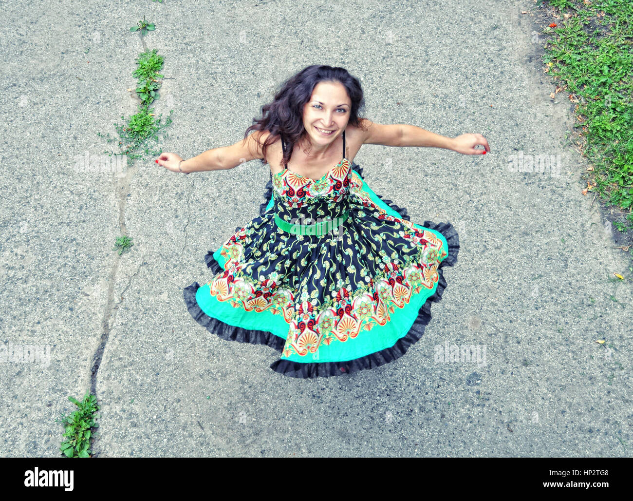 happy woman spinning in a dress on a summer day outdoors Stock Photo ...