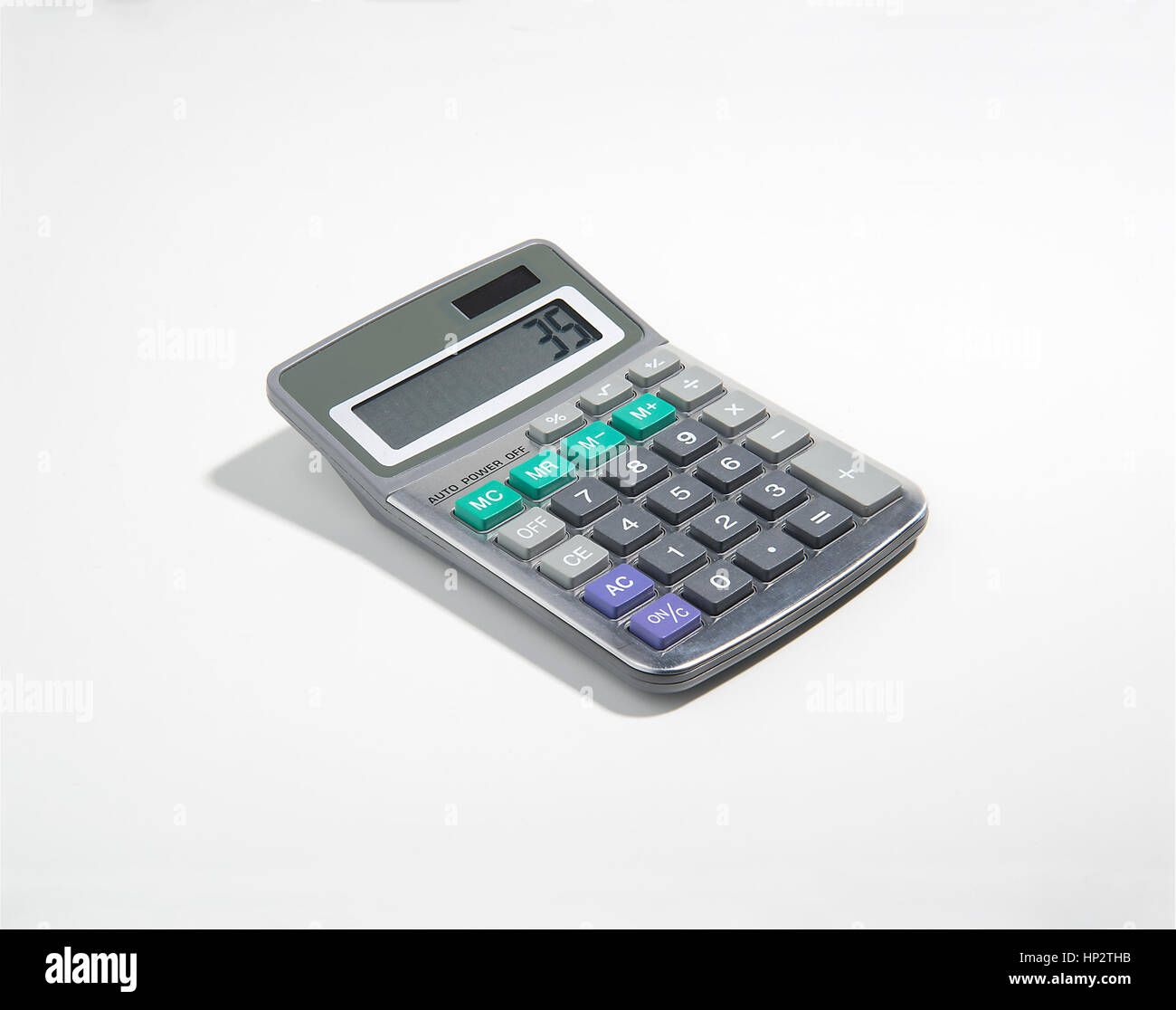 Calculator on grey background business Stock Photo - Alamy