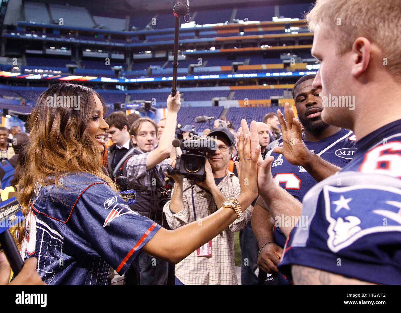 Singer Ciara, left, high fives New England Patriot players, Donald ...