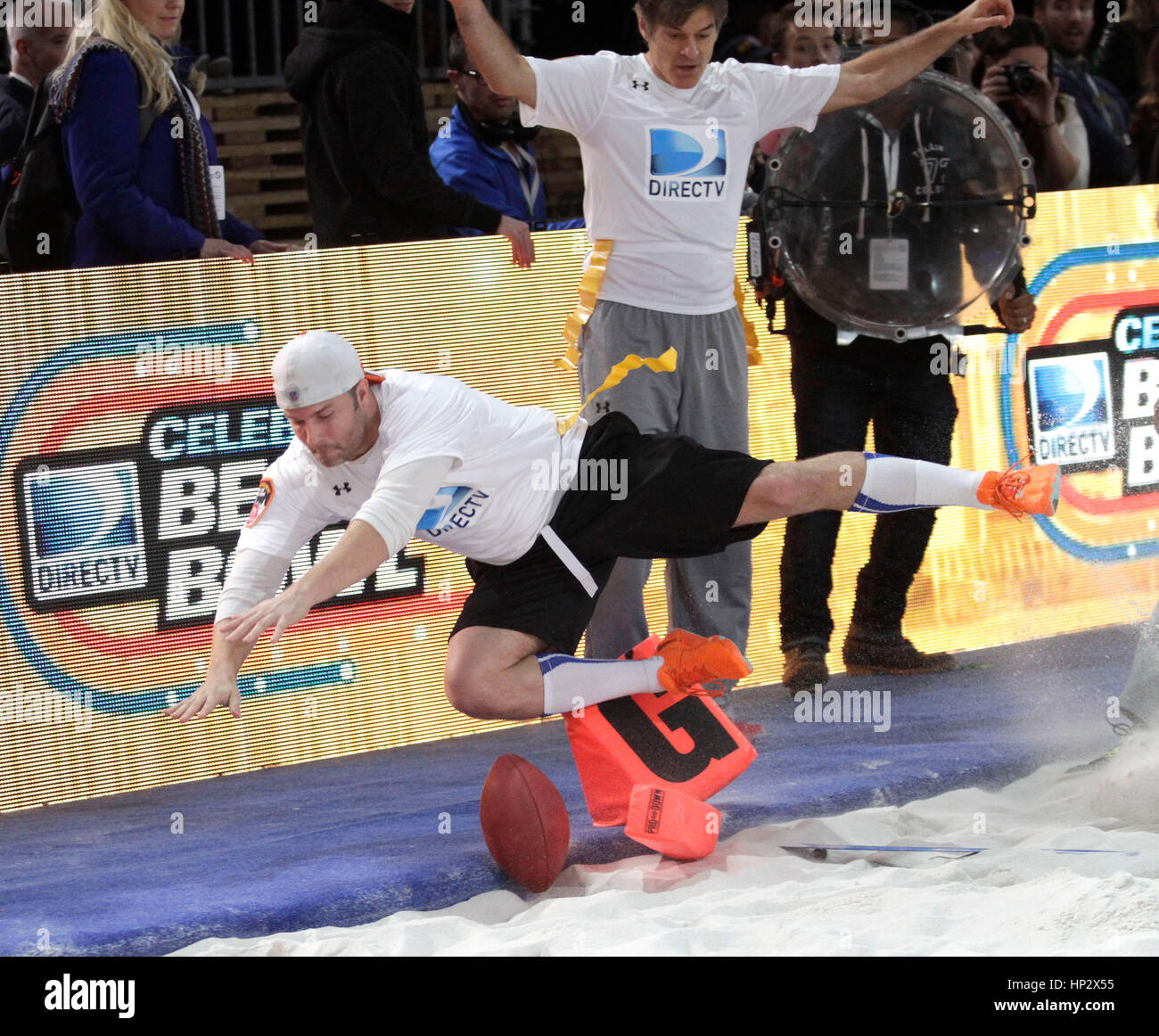 Scott Porter flies into the end zone as Dr. Oz watches at the Directv's ...