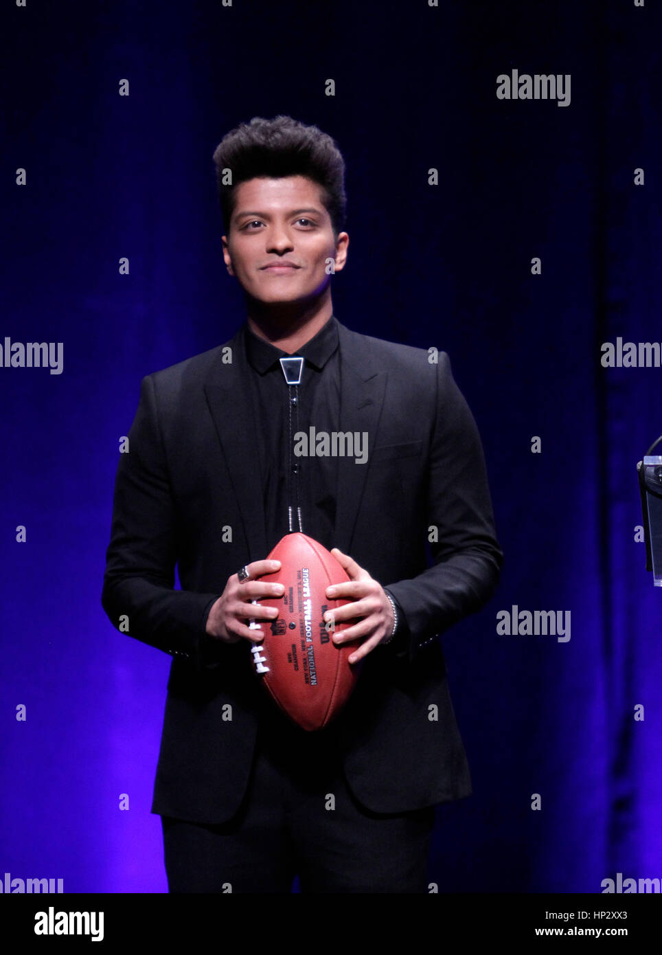 Singer Bruno Mars talks at the press conference for the Super Bowl ...