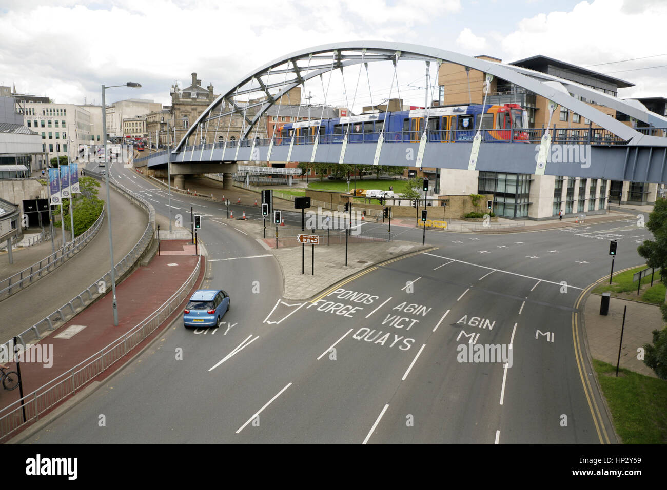 Tram crossing arched bridge over Commercial Street in the centre of ...