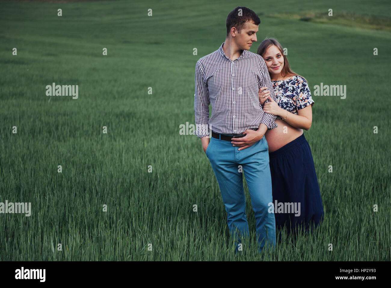 Happy couple awaiting baby. Beautiful and young parents Stock Photo - Alamy