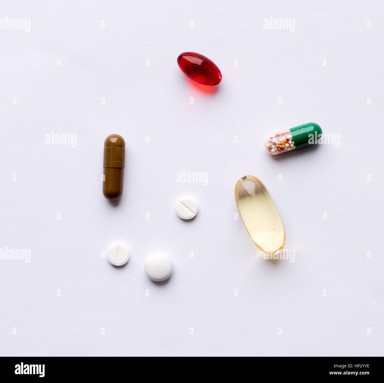 Tabs Vitamins, omega 3, Medications tablets and capsules in a beaker ...