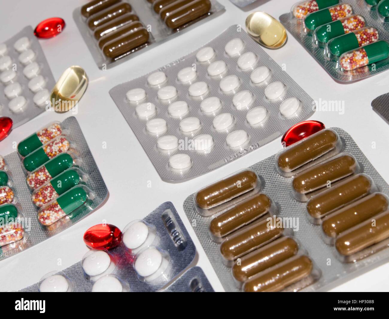 Tabs Vitamins, omega 3, Medications tablets and capsules in a beaker ...