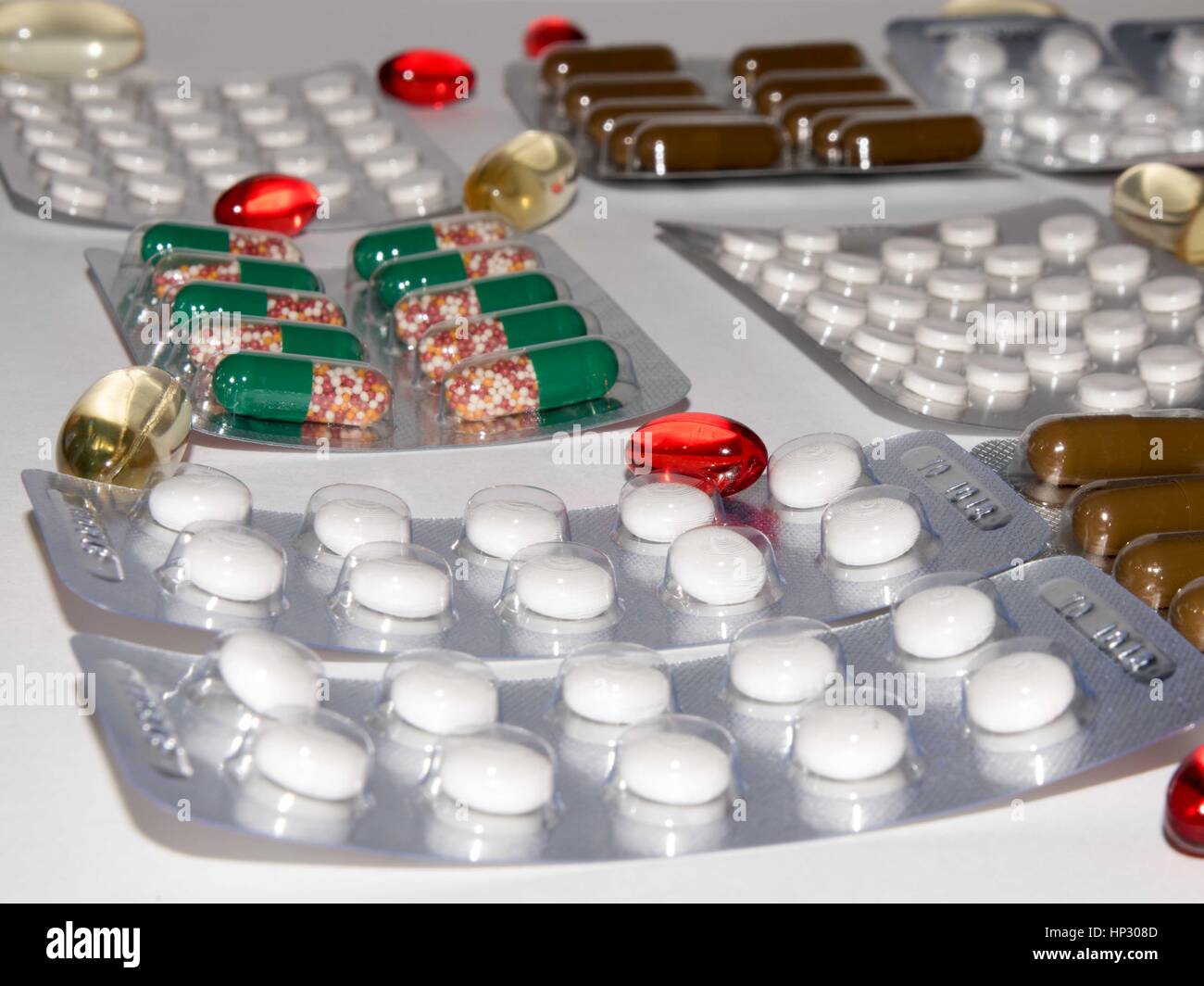 Tabs Vitamins, omega 3, Medications tablets and capsules in a beaker ...