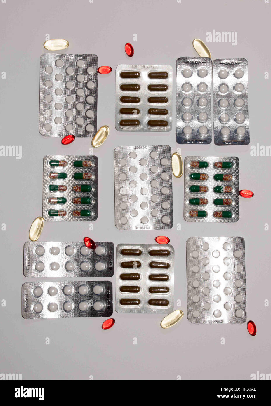 Tabs Vitamins, omega 3, Medications tablets and capsules in a beaker ...