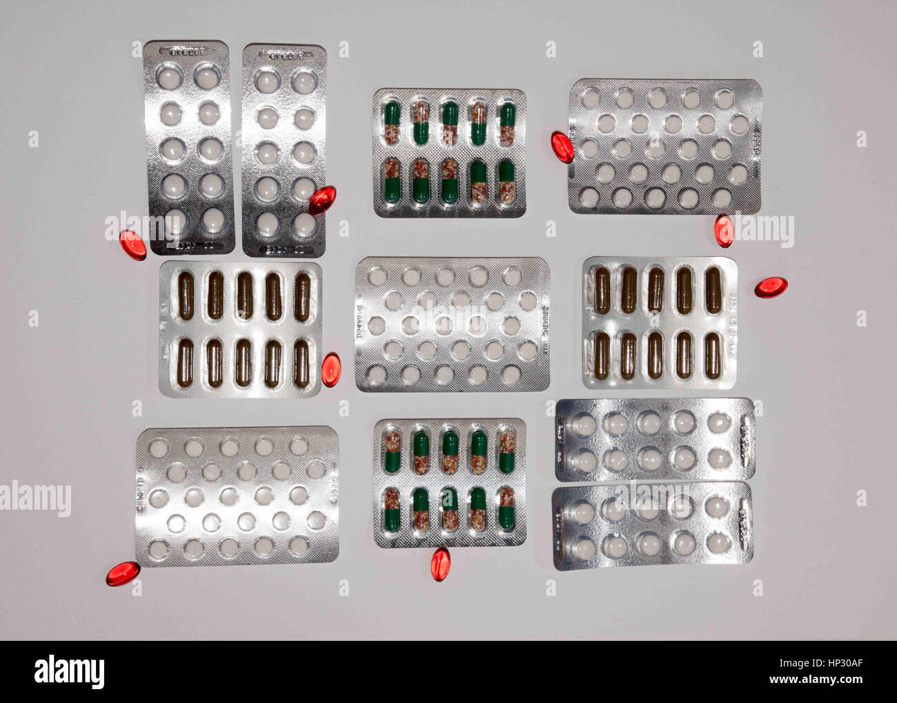 Tabs Vitamins, omega 3, Medications tablets and capsules in a beaker ...