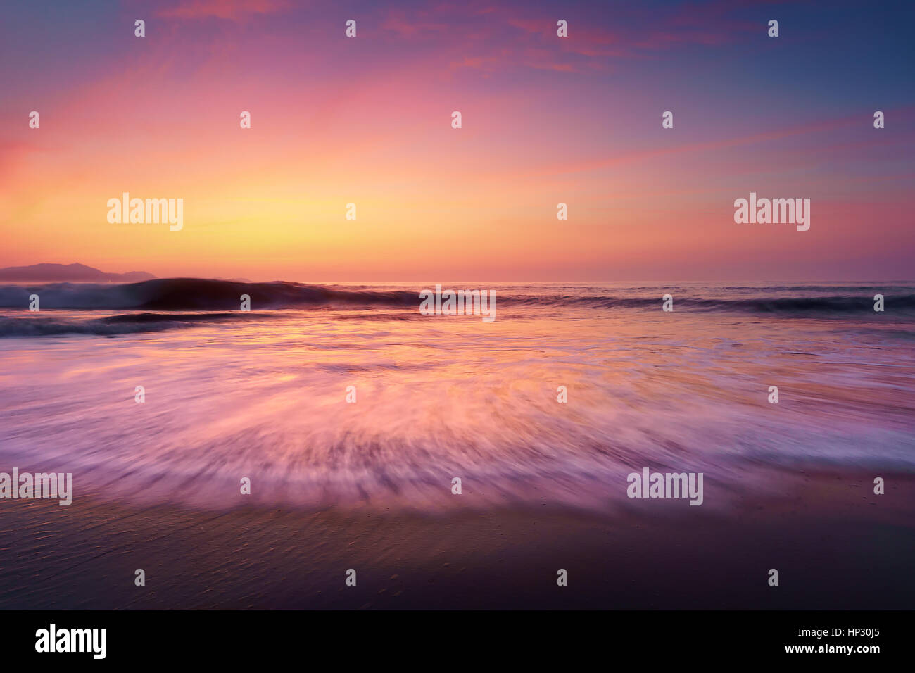 sunset on beach shore Stock Photo - Alamy