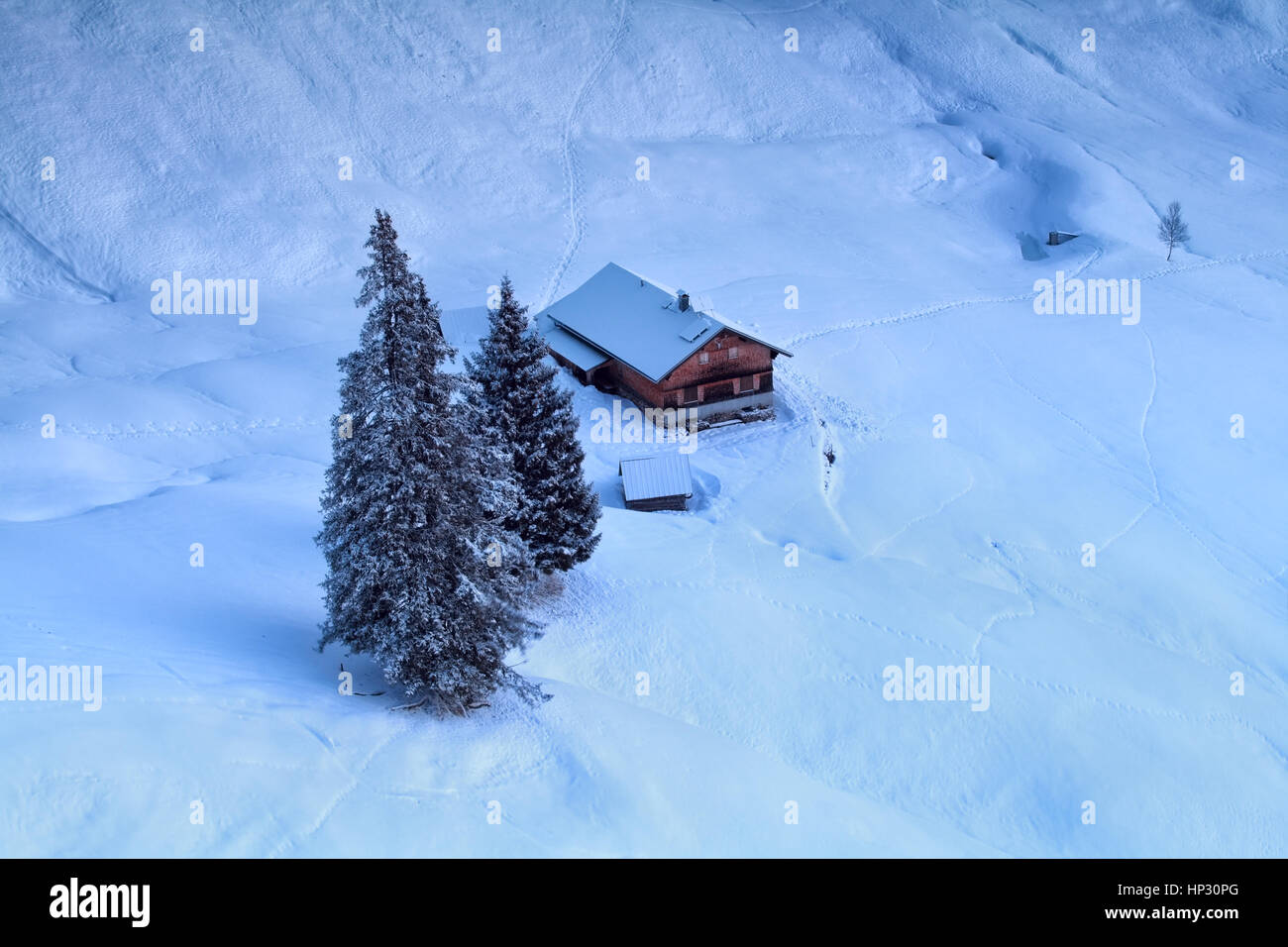 trekking hut in snowy mountains in dusk Stock Photo - Alamy