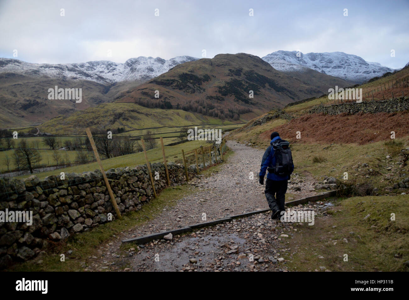 Lone Walker on the Cumbrian Way in the Mickleden Valley with the ...