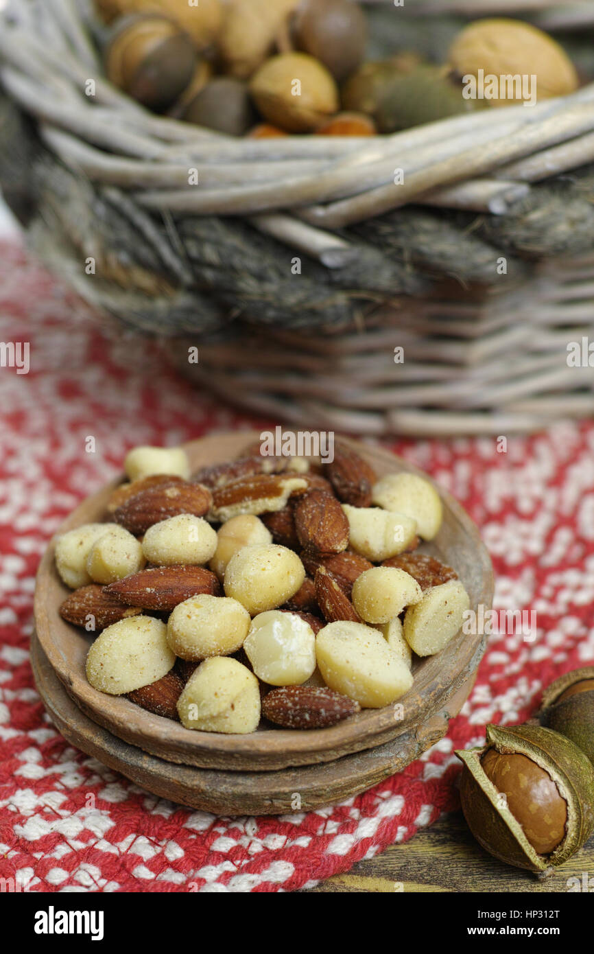 Roasted salted nuts mix, snack from macadamia, walnotes and almonds and ...