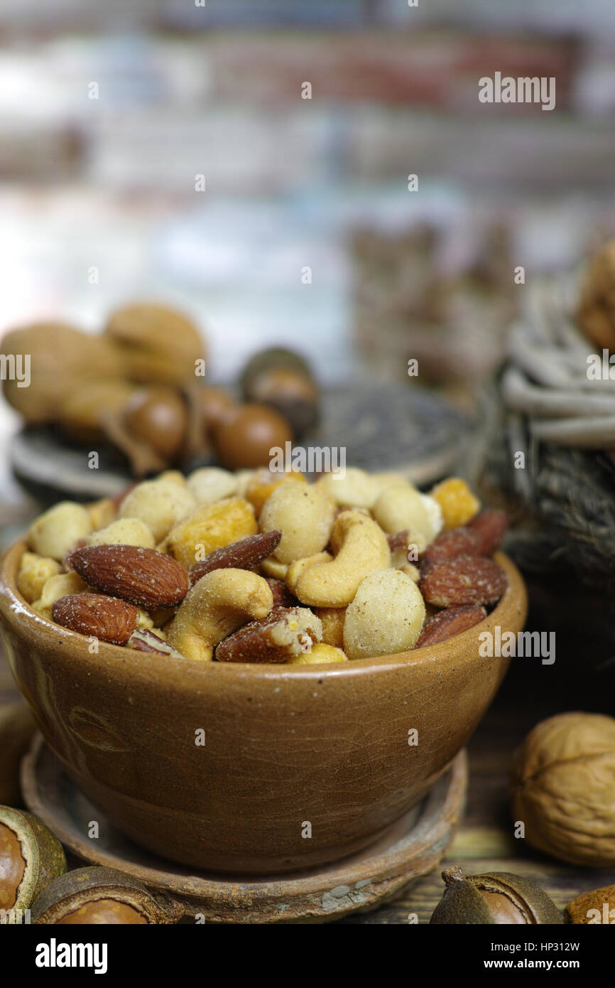 Roasted salted nuts mix, snack from macadamia, walnotes and almonds and ...