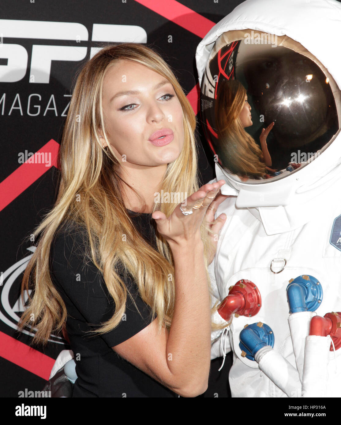 Candice Swanepoel arrives with an Axe Apollo astronaut at the ESPN The ...