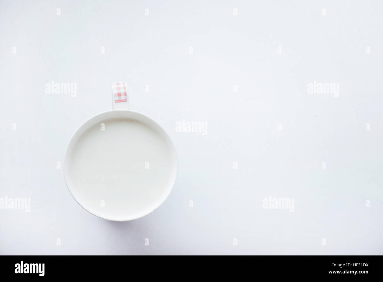 cup of milk on a white background Stock Photo - Alamy